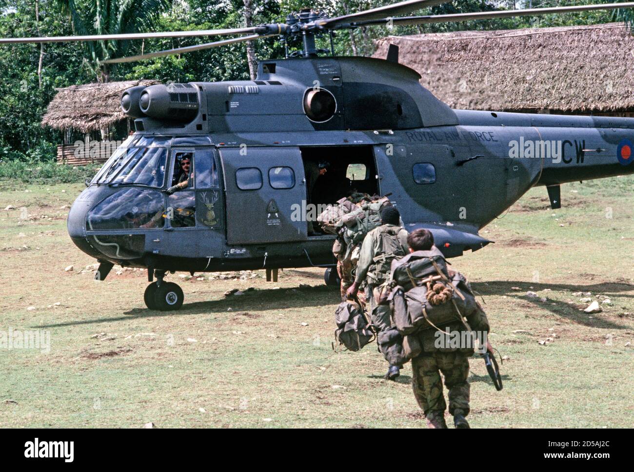 British Army soldiers boarding Royal Air Force helicopter during jungle ...