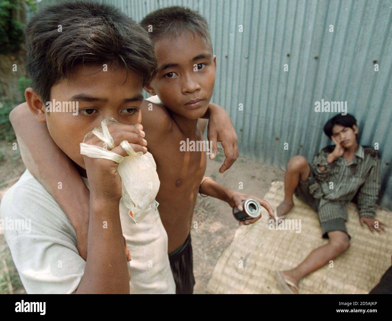 Street children sniffing glue in hi-res stock photography and images ...