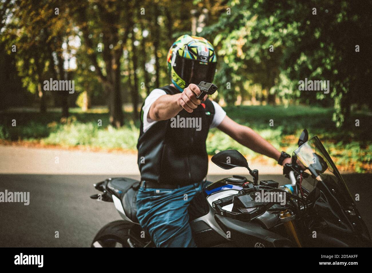 BELGR, SERBIA - Sep 13, 2020: Assassin on the motorcycle is holding gun ...