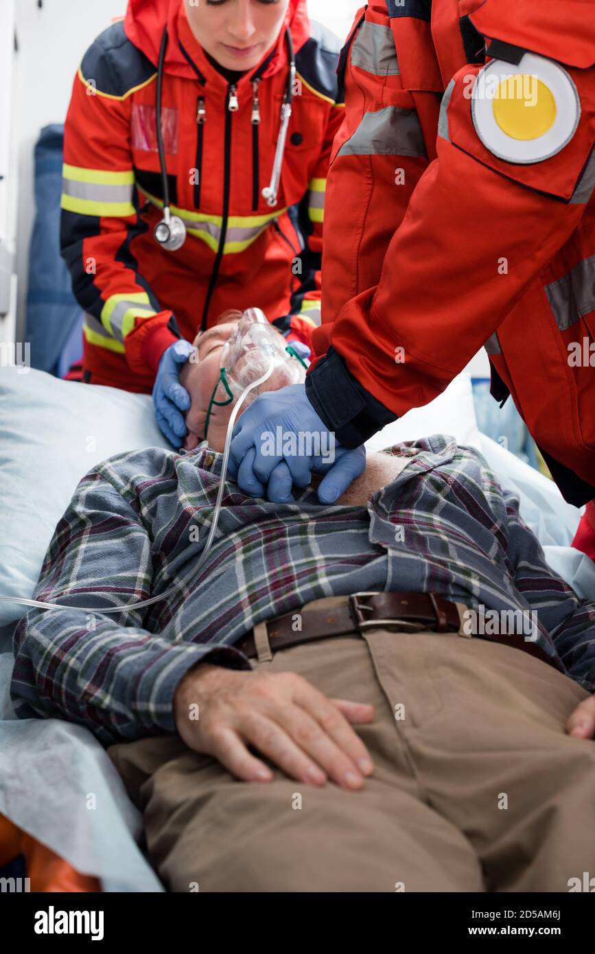 Selective Focus Of Paramedics In Latex Gloves Doing Cardiopulmonary