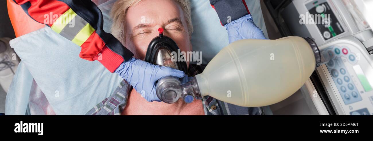 Website header of paramedic doing cardiopulmonary resuscitation to sick ...