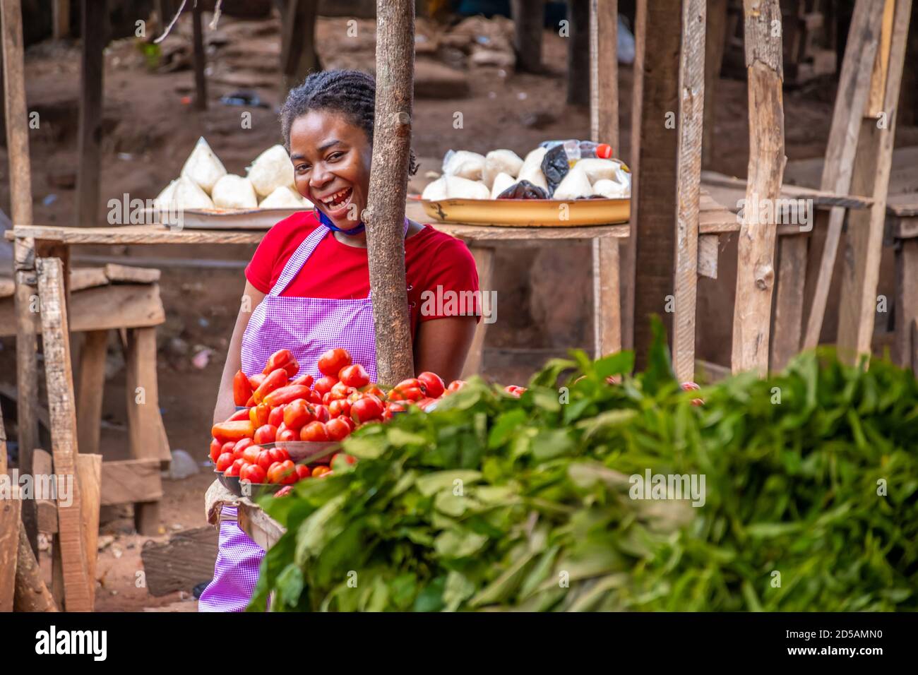 Portrait of a local African market lady smiling Stock Photo - Alamy