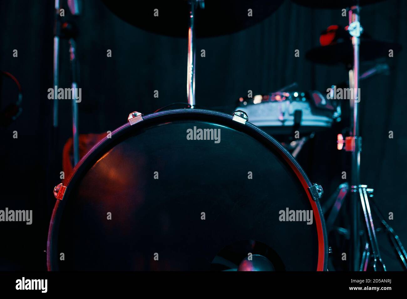 Drums over neon light background. Drum kit on stage for concerts and ...