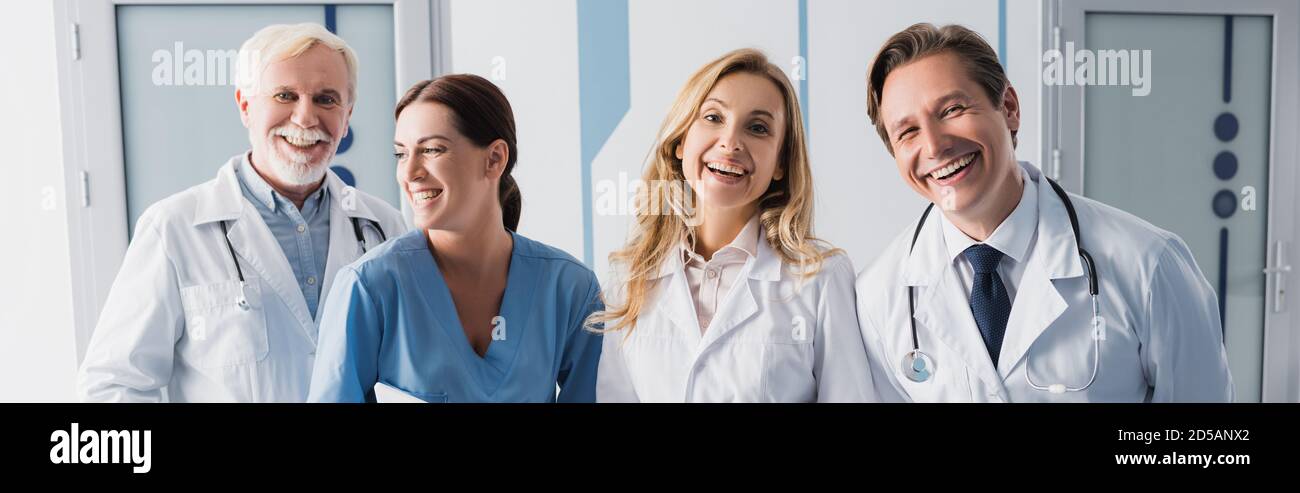 Panoramic orientation of hospital staff looking at camera in clinic ...