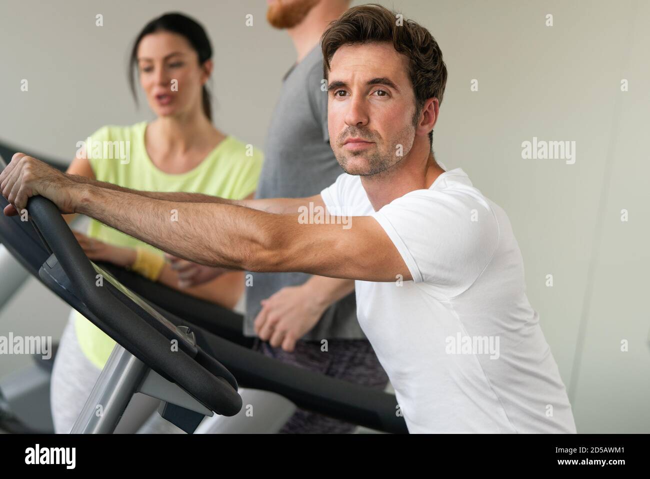 Group of people at the gym exercising on the cardio machines Stock ...