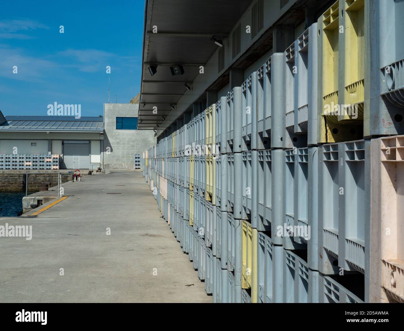 Fish market with metal boxes for storing fish in the port Stock Photo ...
