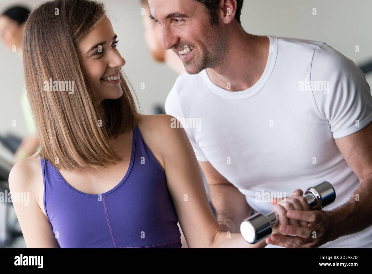 Woman flirting gym instructor hi-res stock photography and images - Alamy