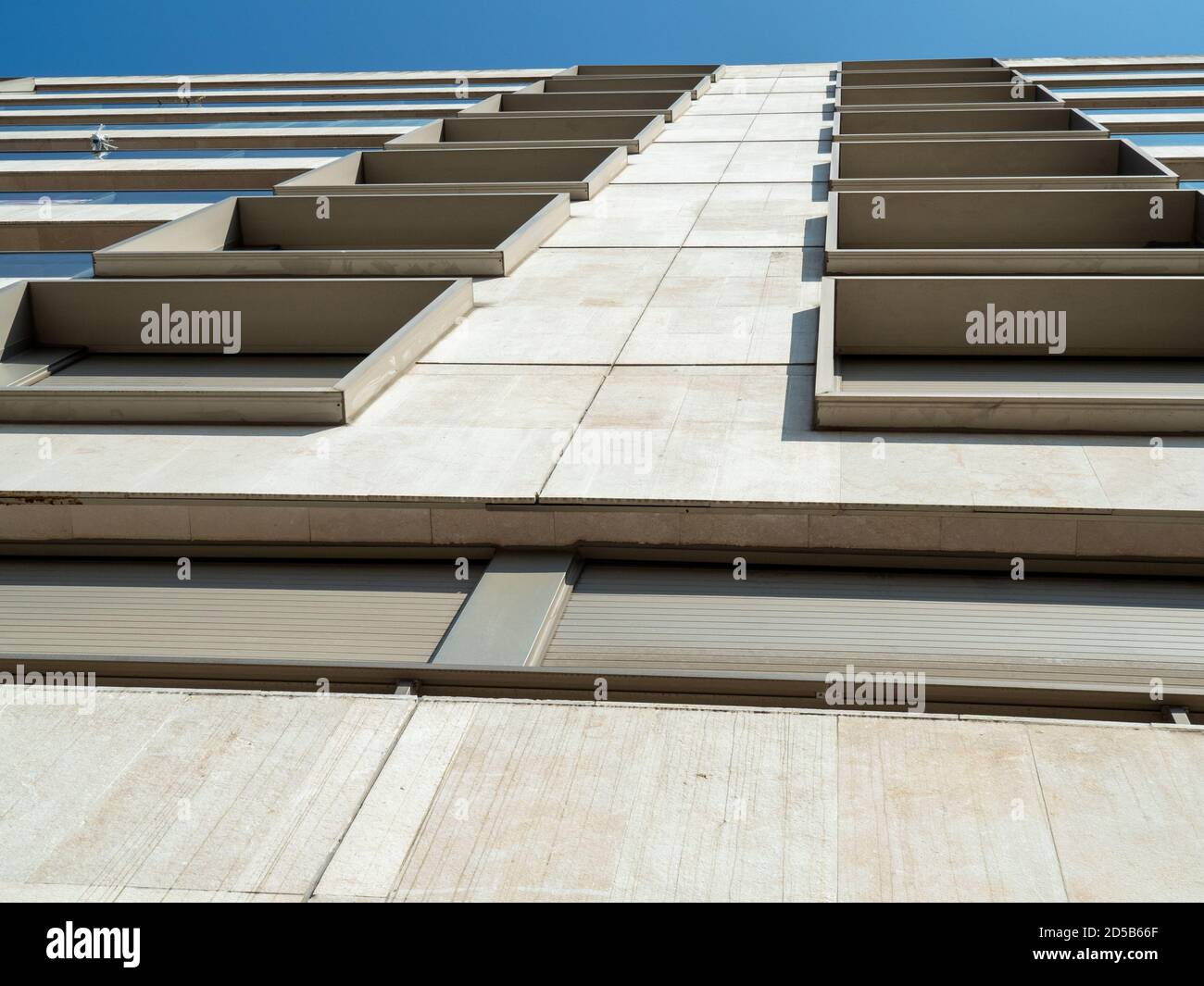 Low angle shot of a building in Bilbao at noon on background of the ...