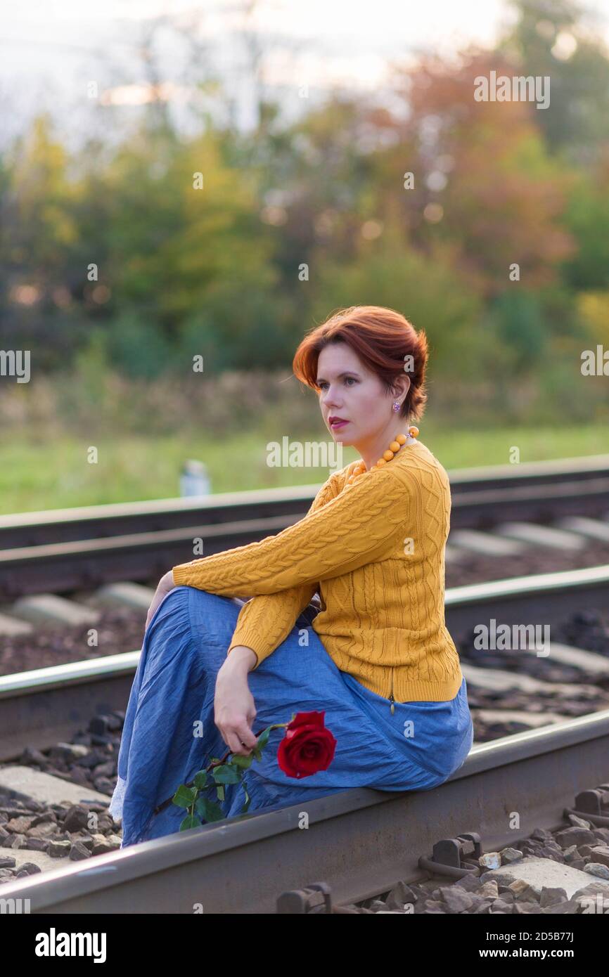 Sad girl on railway hi-res stock photography and images - Alamy