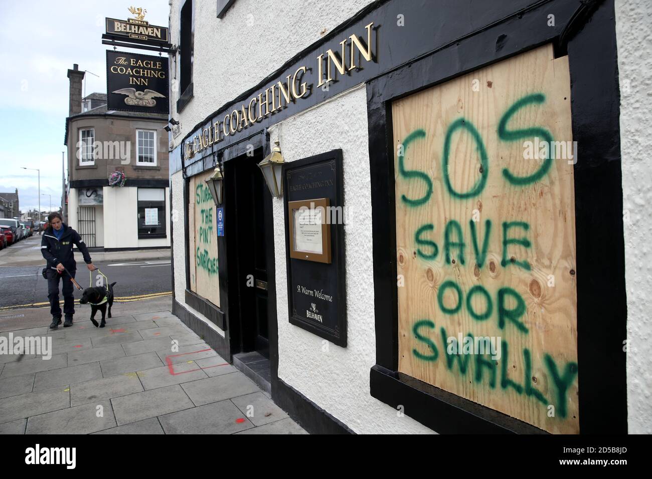 A Member of the public walks past the The Eagle Coaching Inn in ...