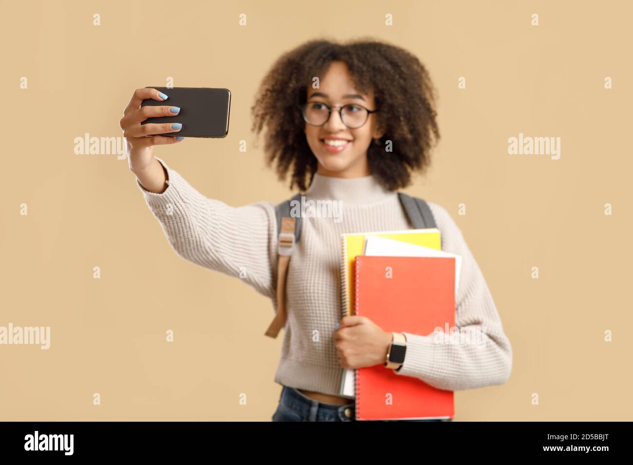 Photo for educational blog. Smiling smart african american young lady ... Photo for educational blog. Smiling smart african american young lady ...
