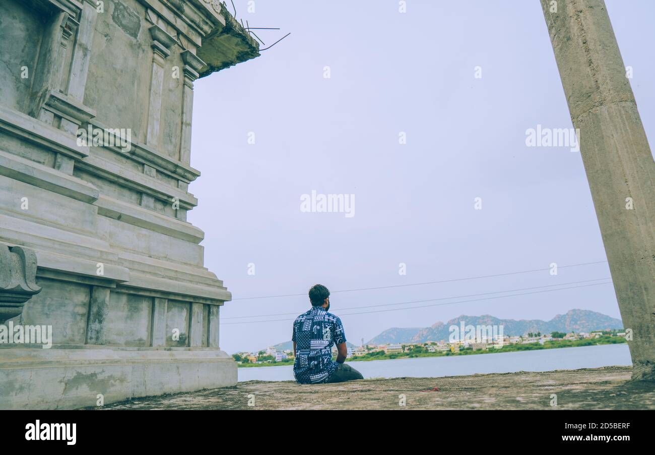 Person sitting alone hi-res stock photography and images - Alamy
