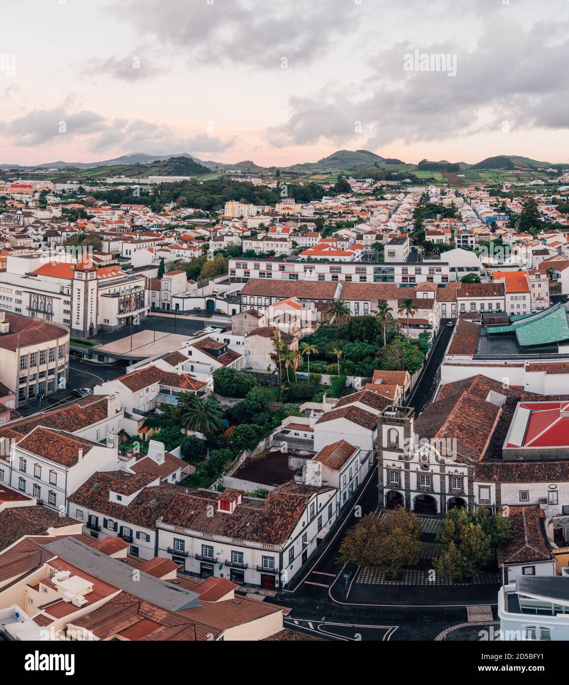 Aerial shot of a beautiful old town by the ocean in Sao Miguel Island ...