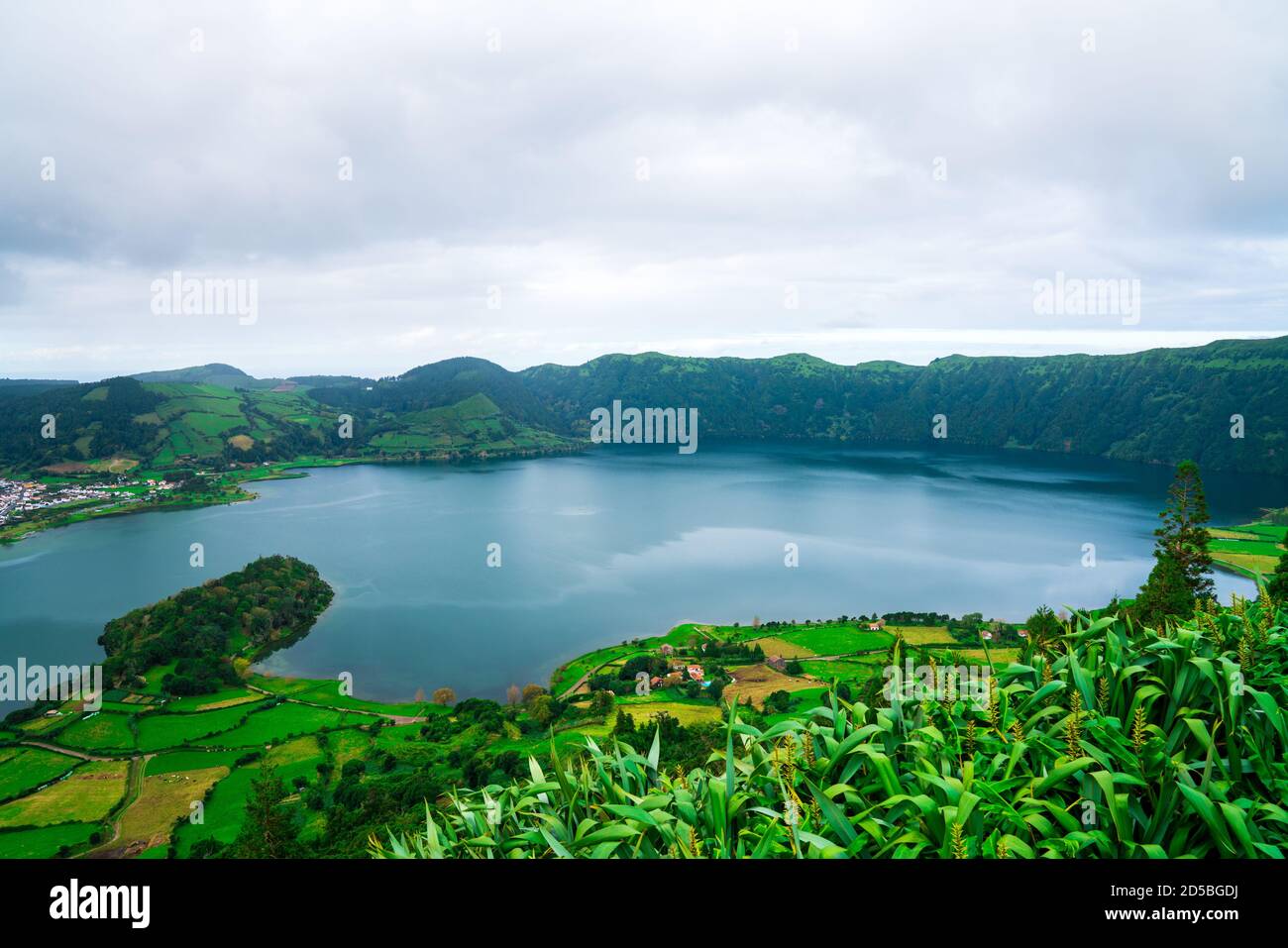 Beautiful village surrounded by lake, mountains and fields in Azores ...