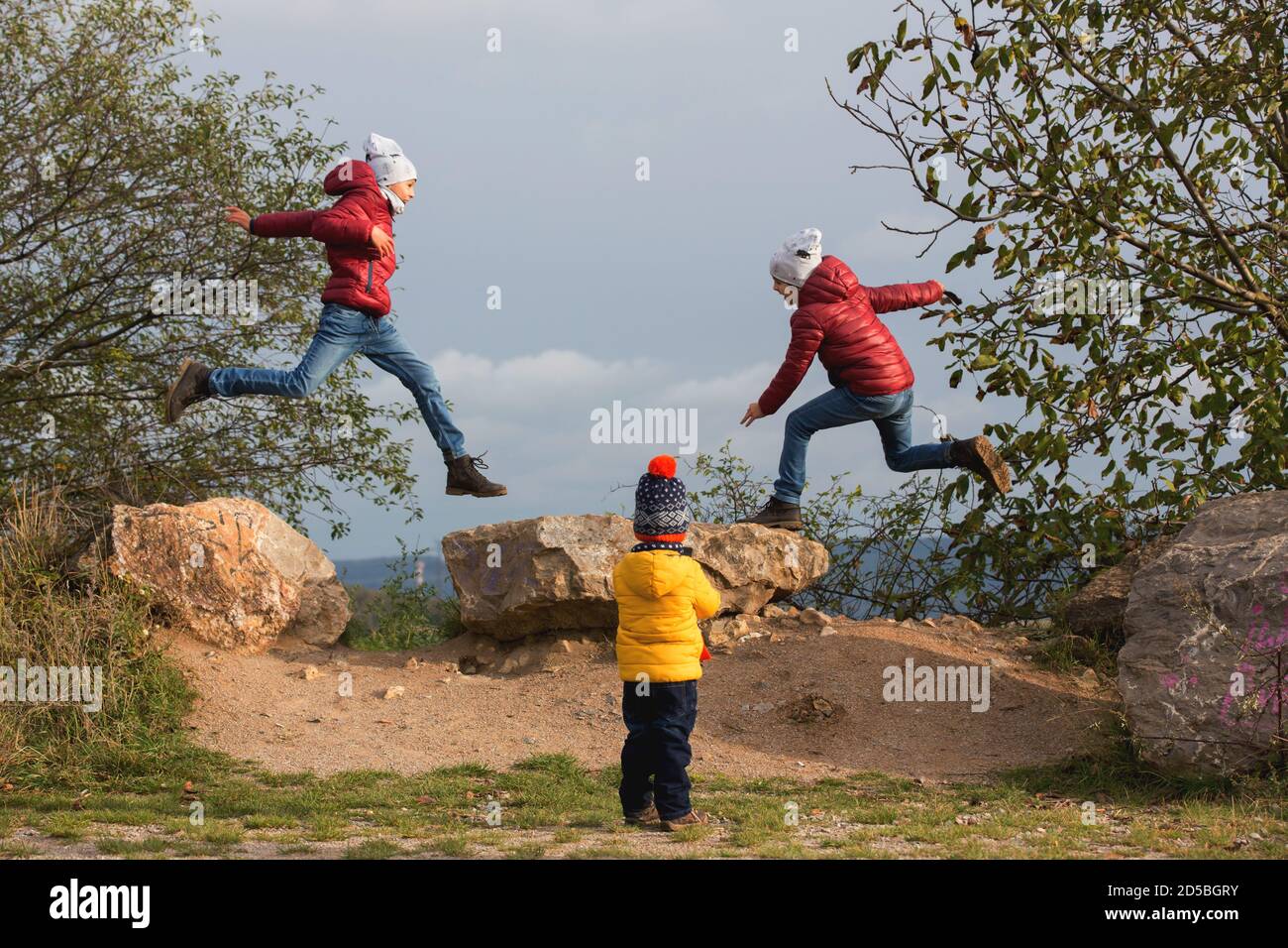 Happy children, running and jumping and playing in autumn park Stock ...