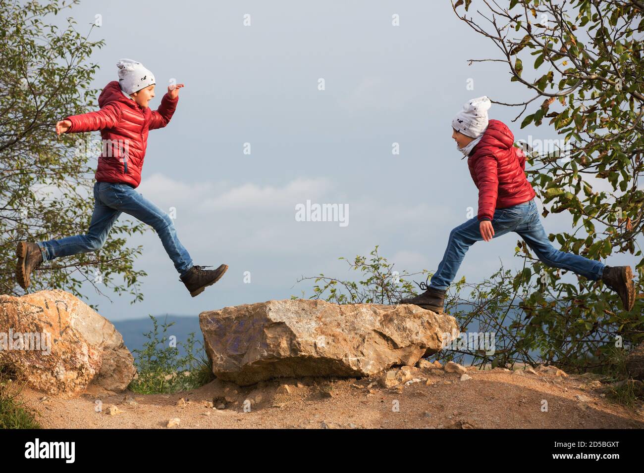 Happy children, running and jumping and playing in autumn park Stock ...