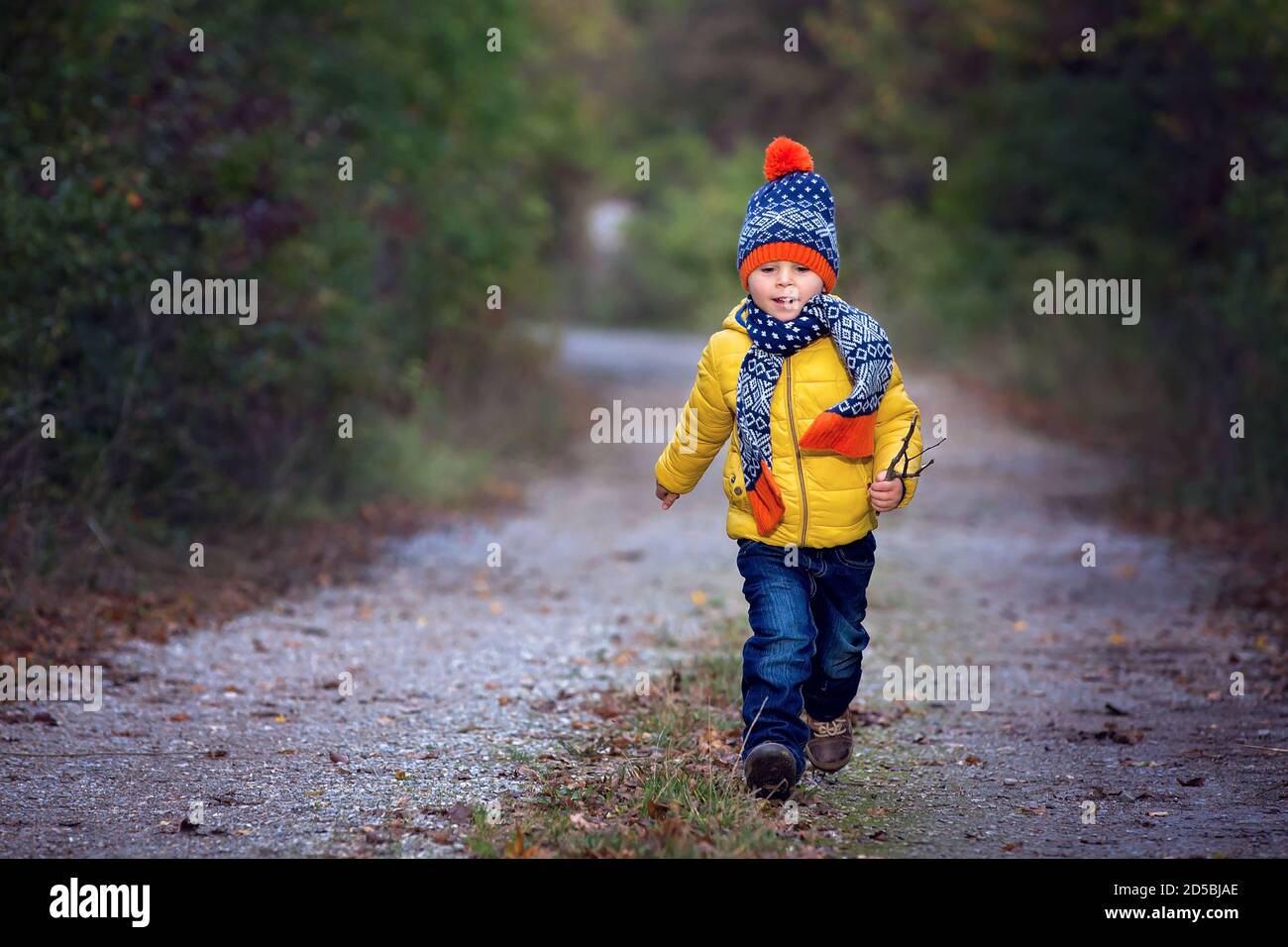 Kid jumping happily hi-res stock photography and images - Alamy
