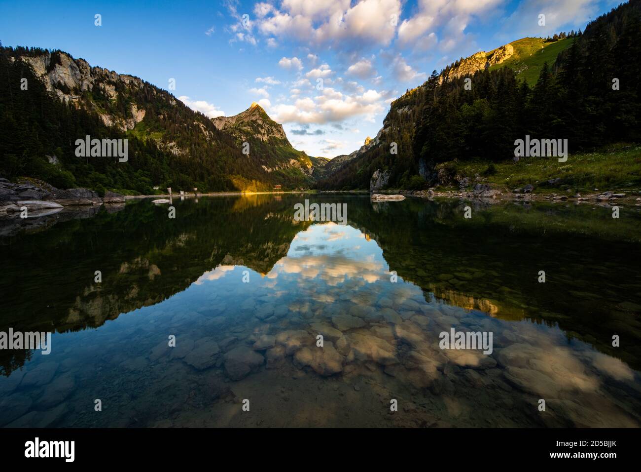 Lake in the swiss alps at sunrise Stock Photo - Alamy
