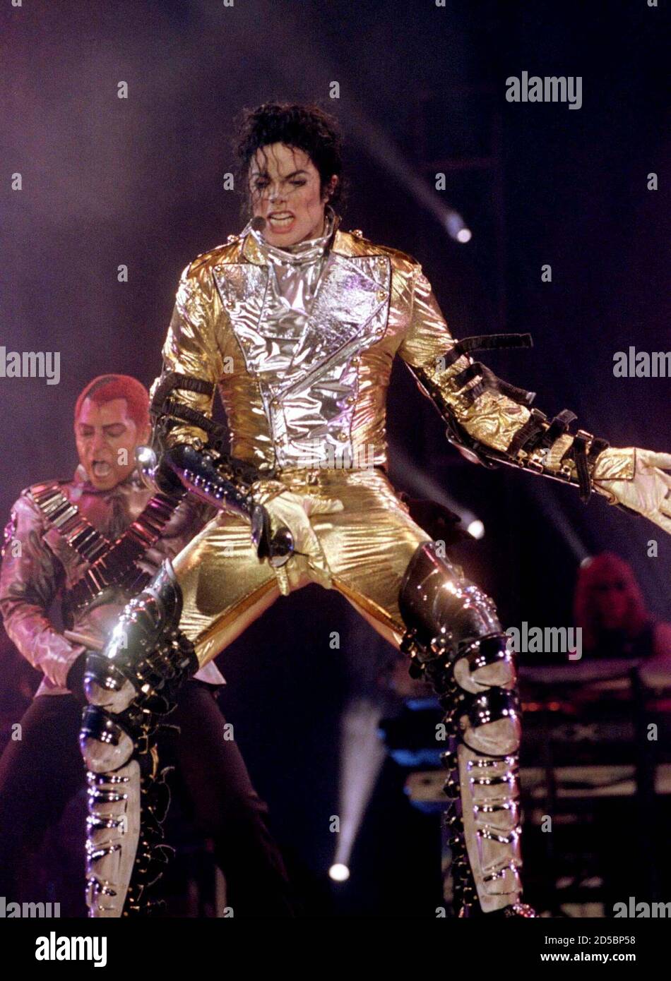 Pop superstar Michael Jackson grabs his crotch during his first of two ...
