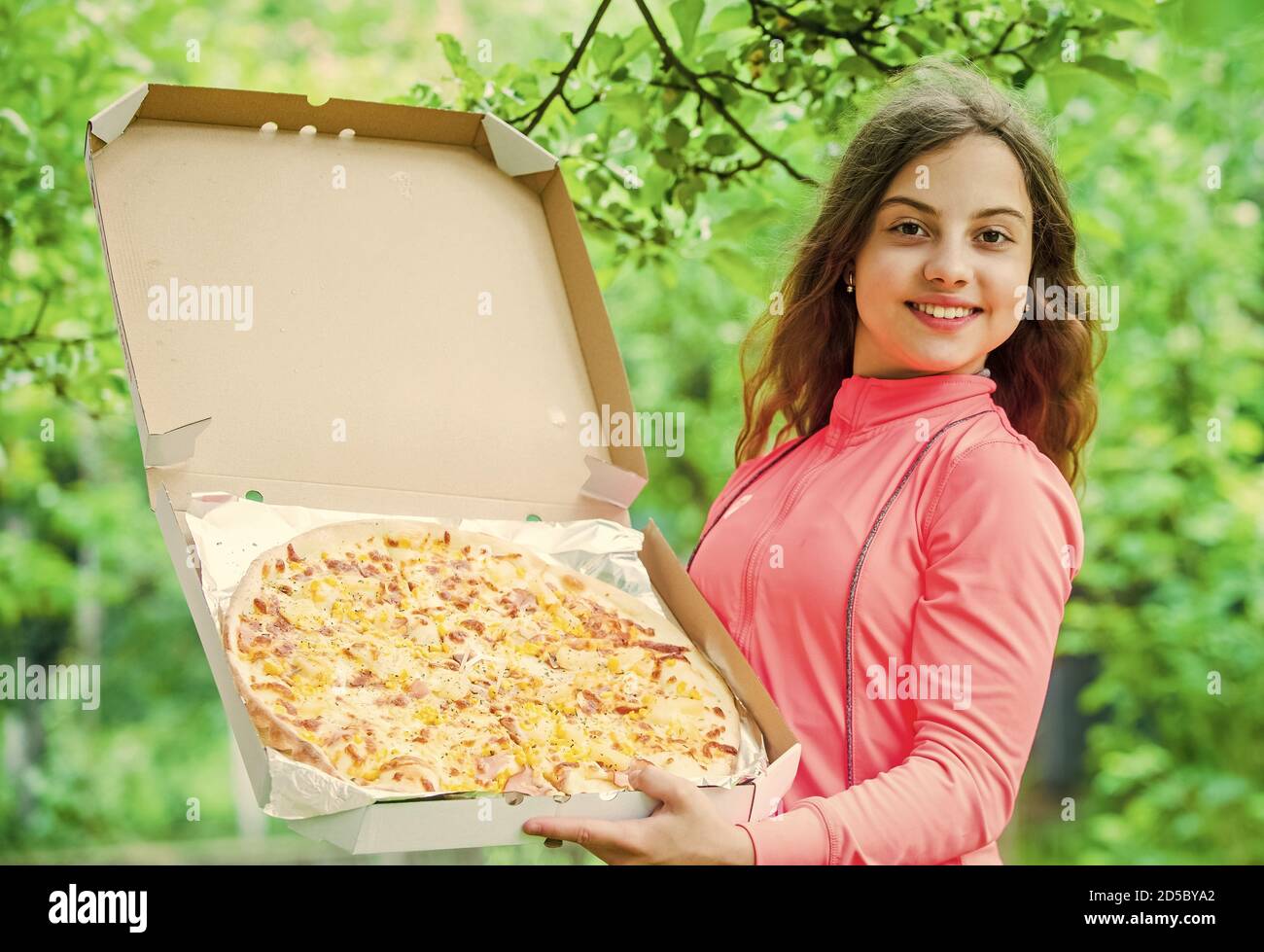 Hungry girl pizza box nature background, picnic time concept Stock ...