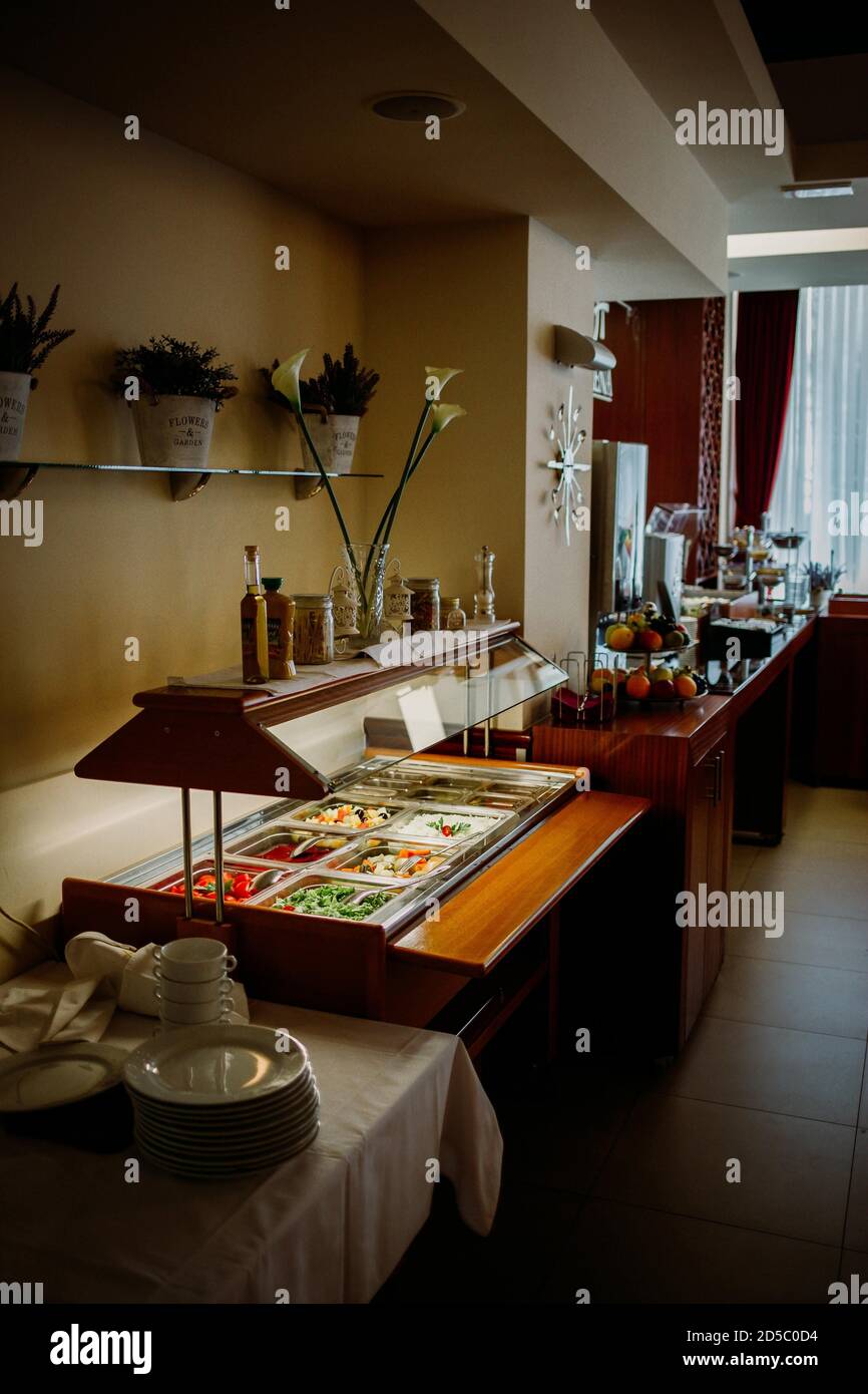 Atmospheric vertical shot of a buffet restaurant interior Stock Photo ...