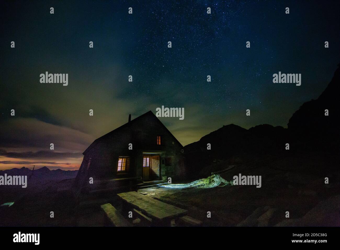 Mountain hut at night Stock Photo - Alamy