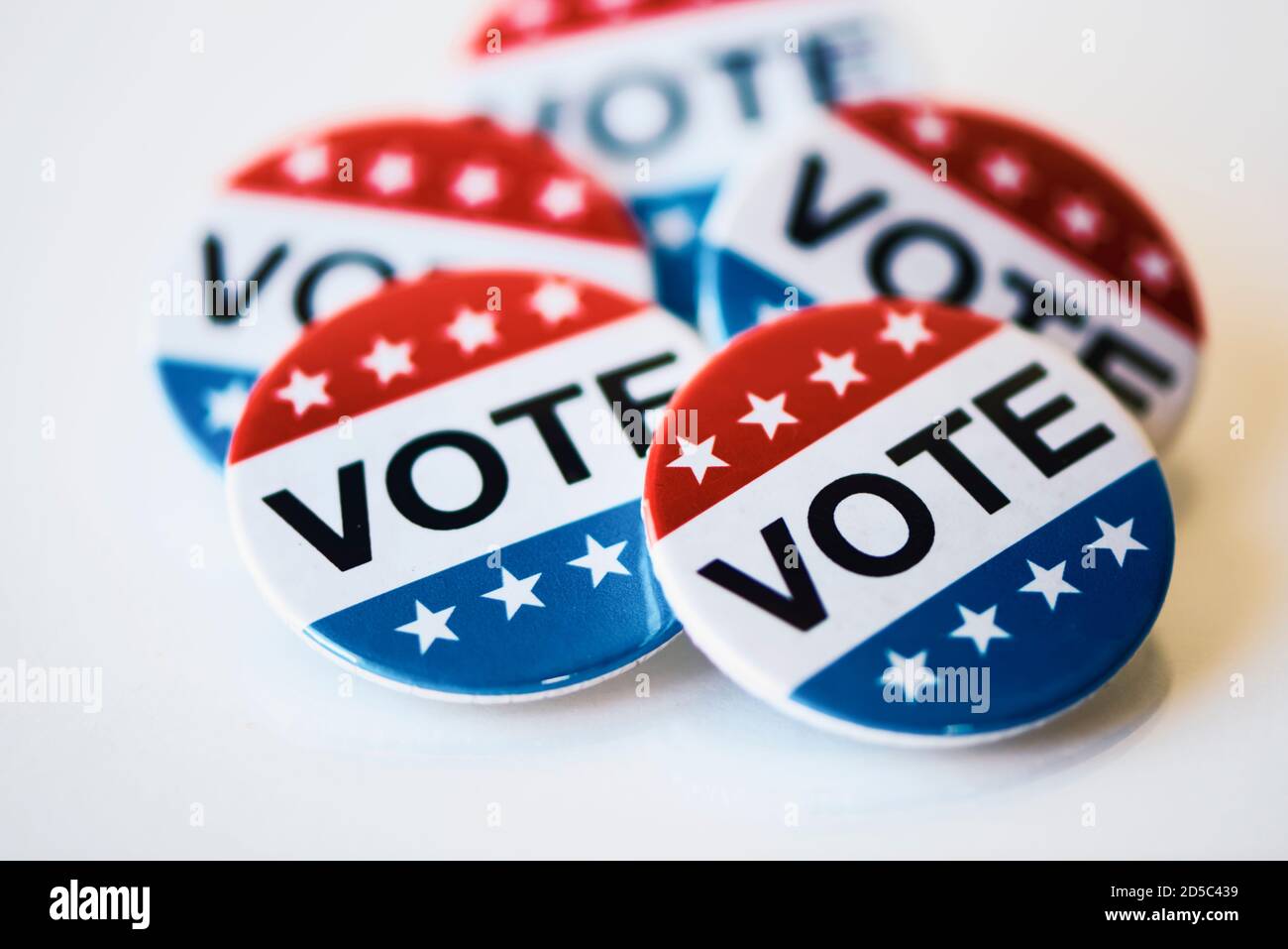 closeup of some vote badges for the United States election on an off ...