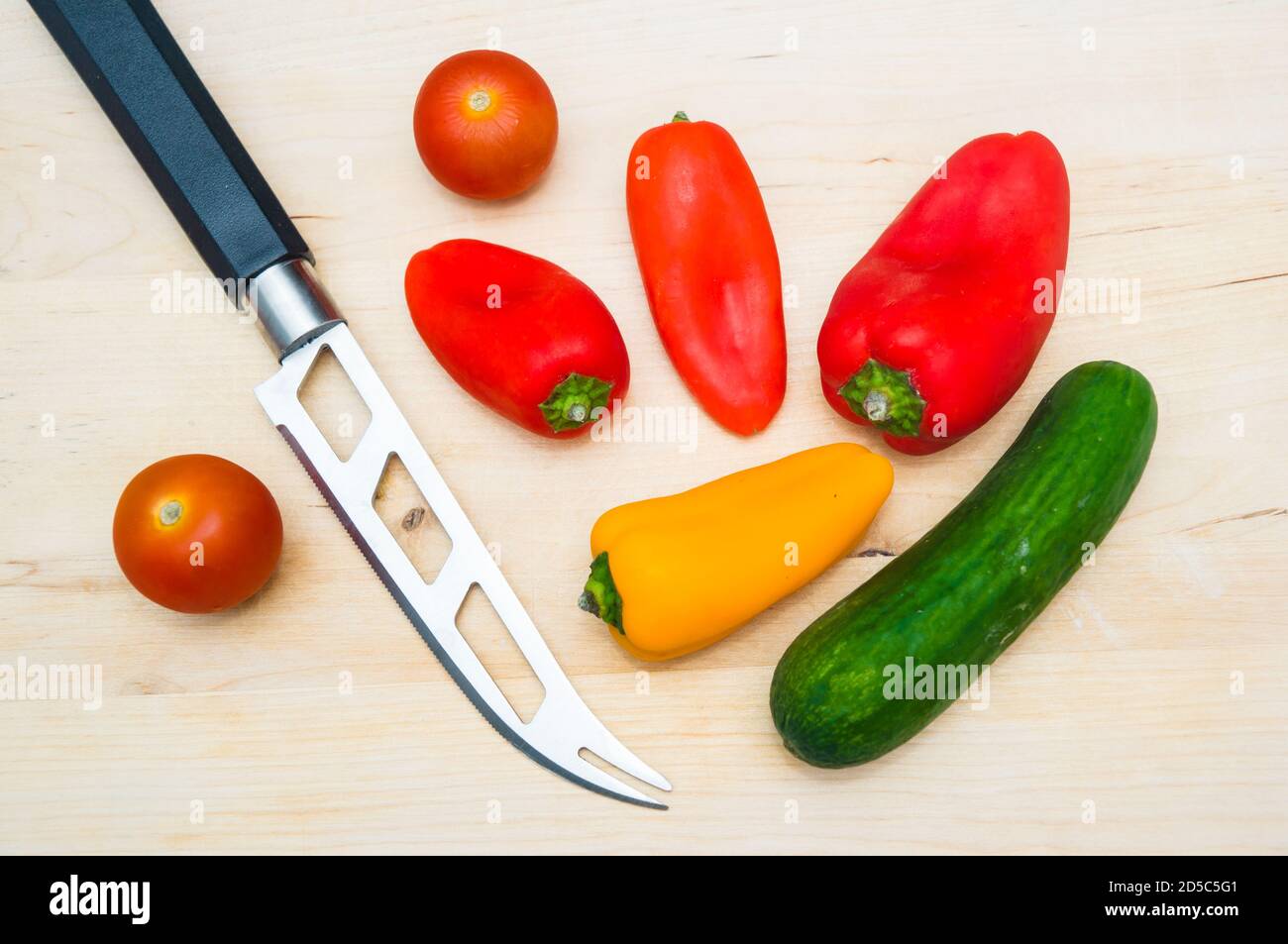 Overhead shot of vegetables and a sharp knife in a kitchen Stock Photo ...