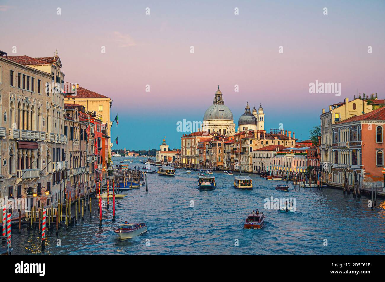 Venice cityscape with Grand Canal waterway. Buildings with evening ...