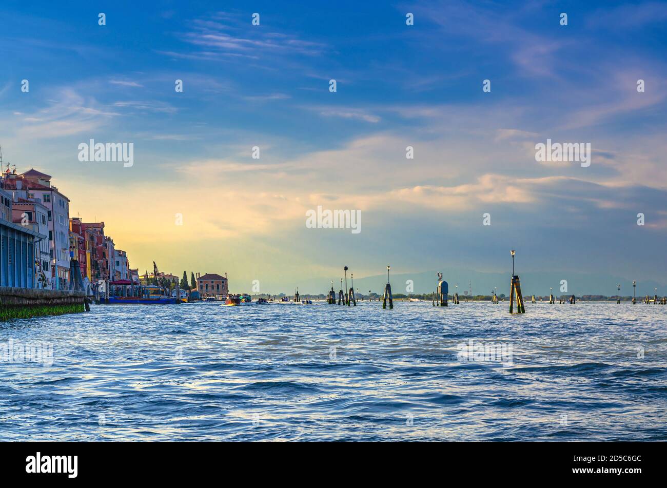 Yacht boats racing sailing on water of Venetian lagoon between wooden ...
