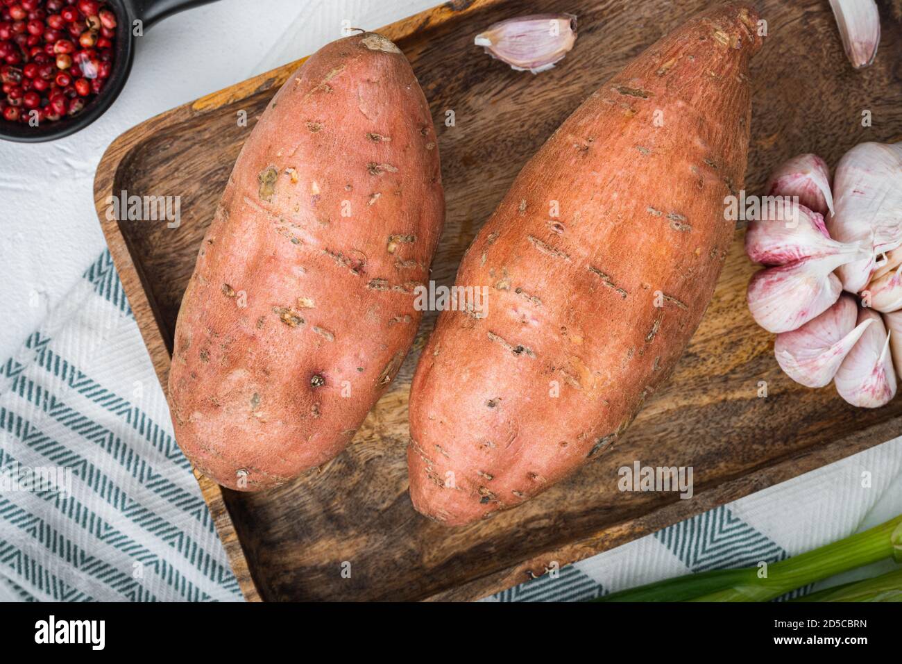 Sweet potato or batat with spices on white background, top view Stock ...