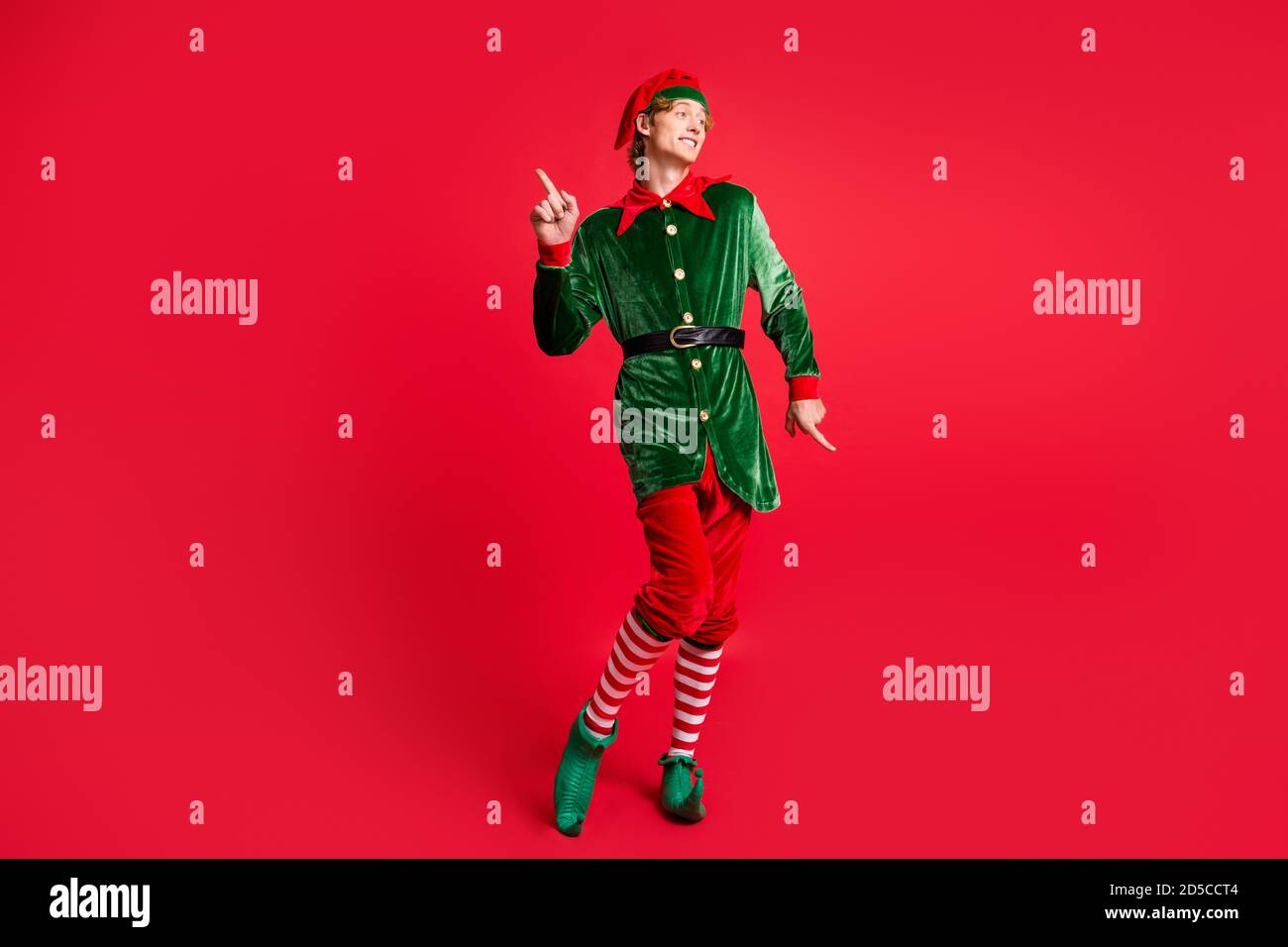 Full length photo of handsome x-mas north-pole jolly elf dance wear x ...