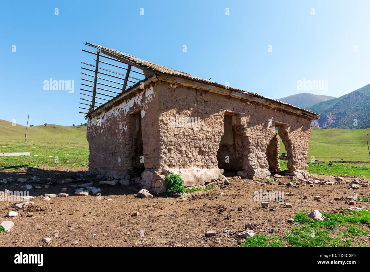 An old abandoned house. No people. The building is made of adobe and ...