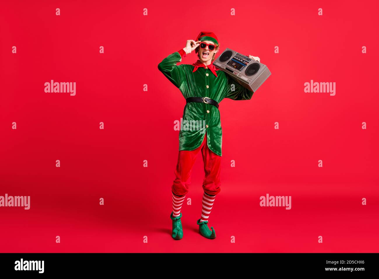 Full body photo of crazy elf hold boom box x-mas festive event concept ...