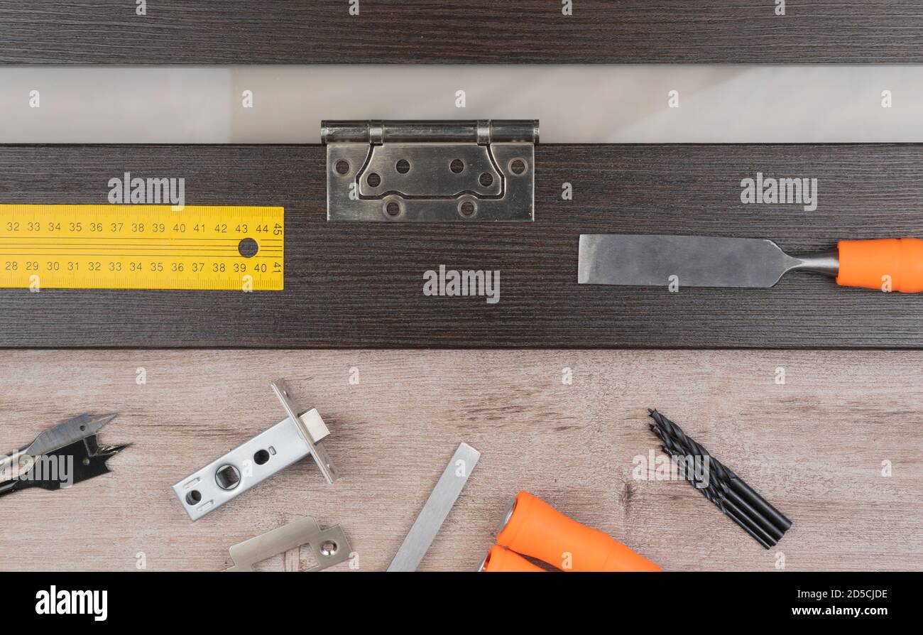 insert the lock into the interior door. joinery. tools and materials ...