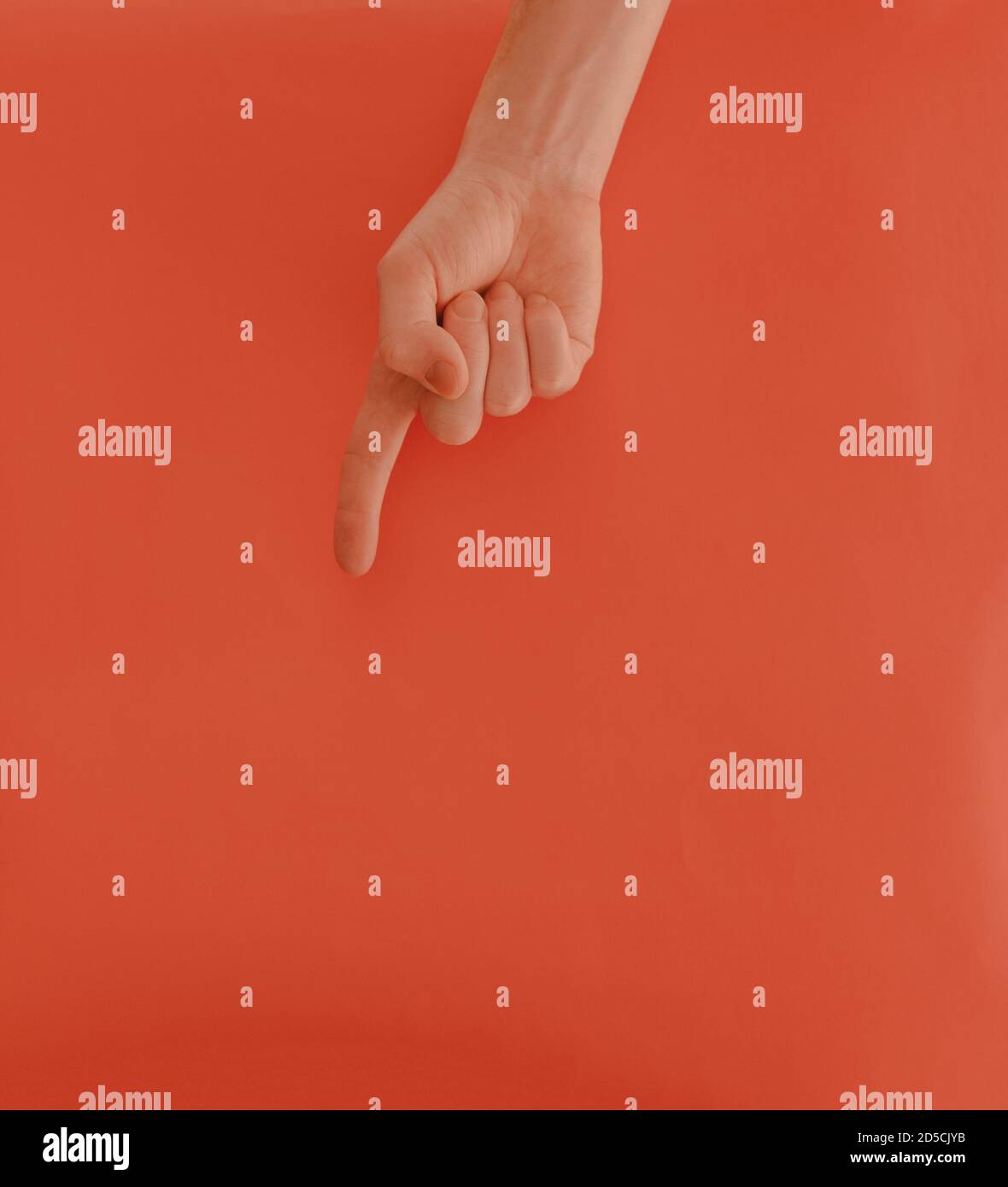 Vertical shot of a hand showing "down Stock Photo - Alamy