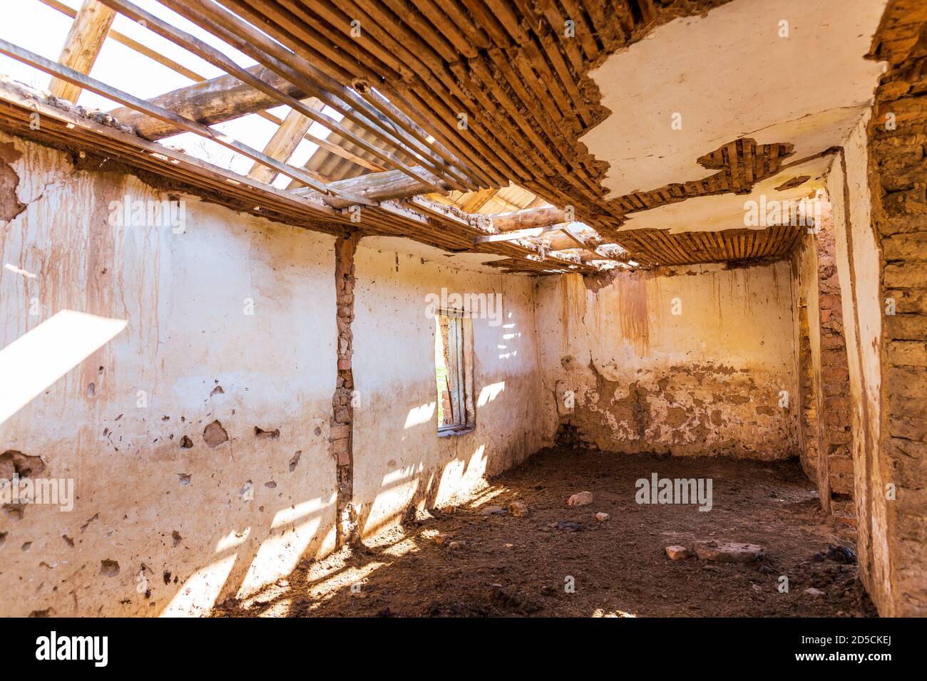 An old abandoned house. No people. The building is made of adobe and ...