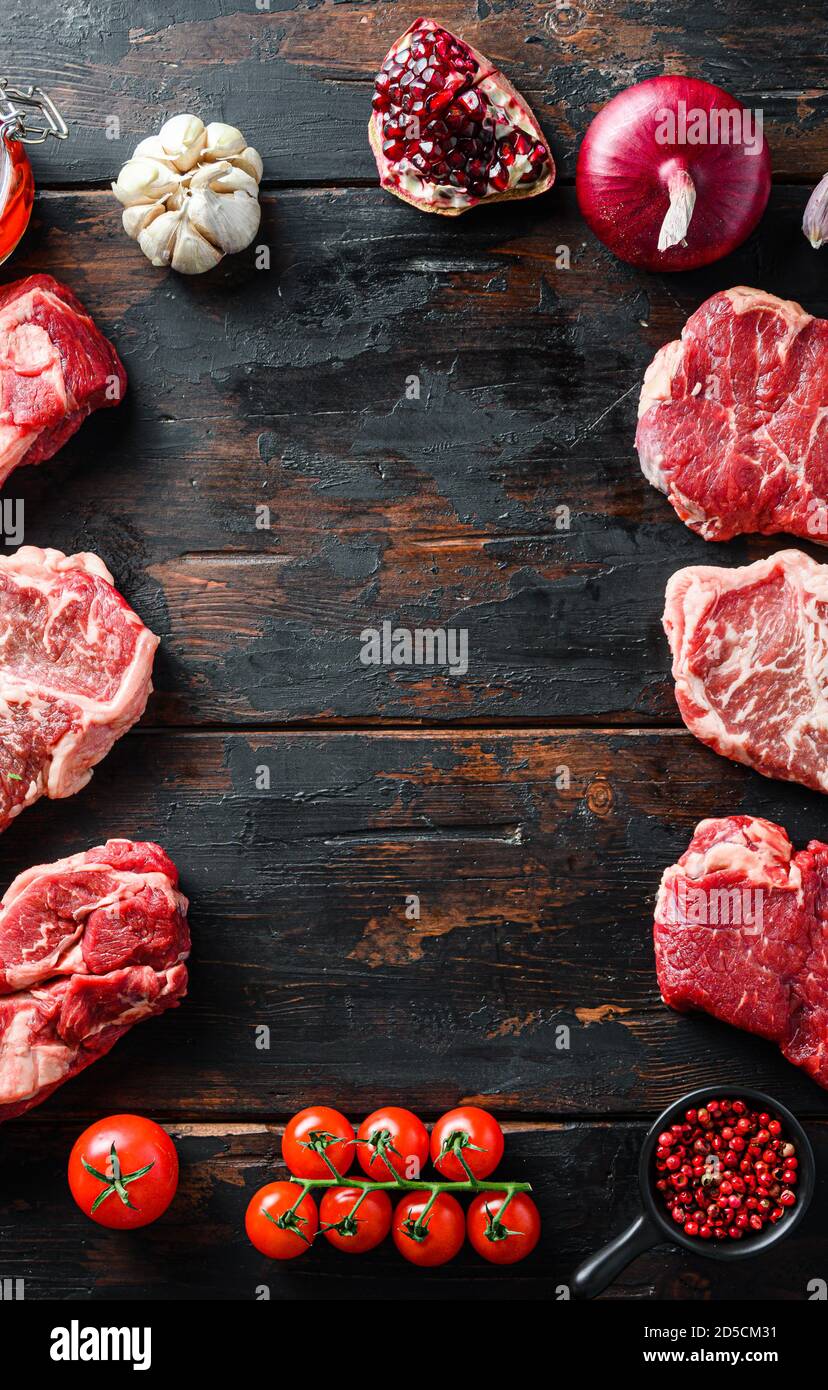 Meat beef steaks frame concept, with different steak cuts on dark old ...
