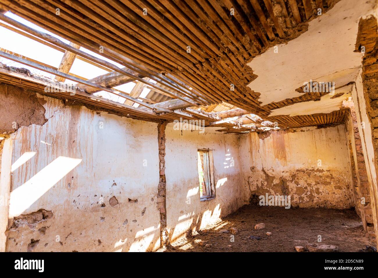 An old abandoned house. No people. The building is made of adobe and ...