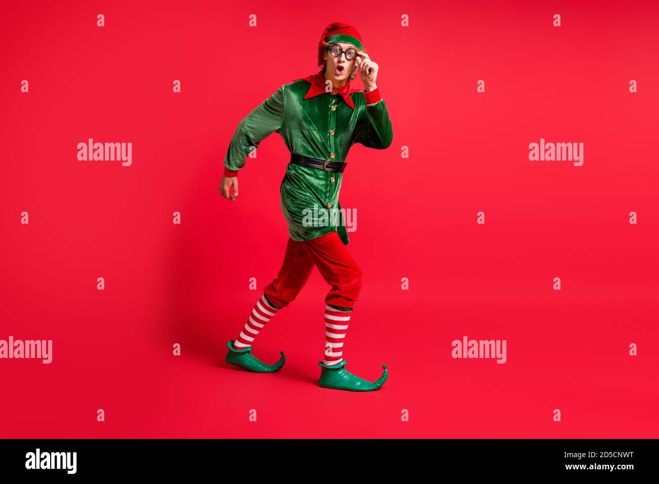 Full body profile side photo of astonished elf go empty space wear ...