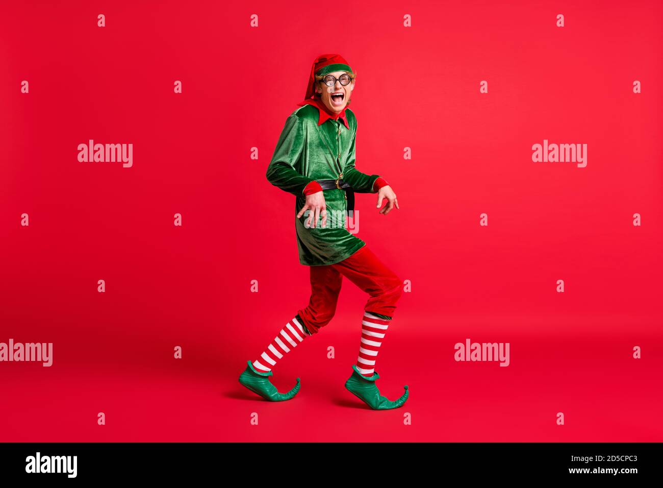 Full body profile side photo of crazy naughty elf sneak x-mas copyspace ...