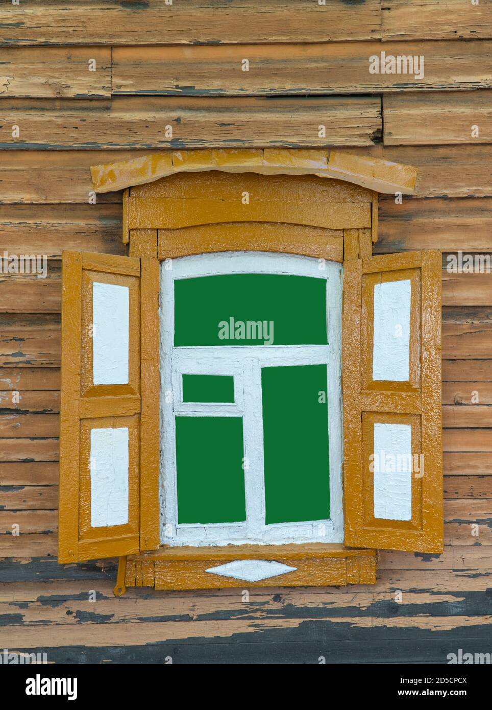 old wooden window with open shutters on the wall with worn paint ...