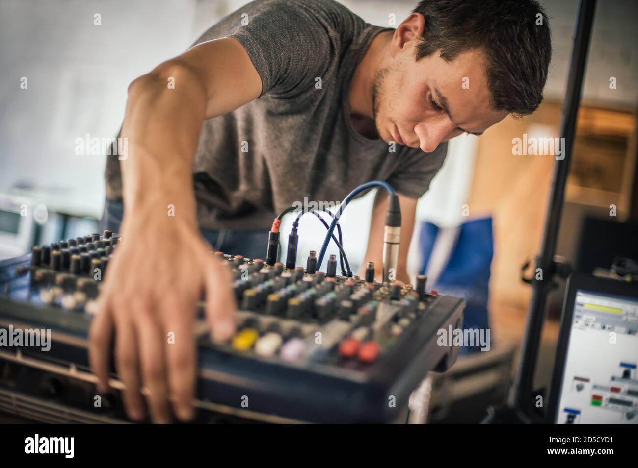 Behind the scene. Sound technician electric engineer adjusting sound ...