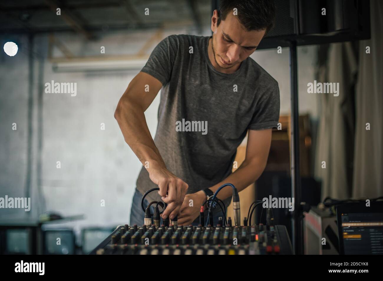 Behind the scene. Sound technician electric engineer adjusting sound ...