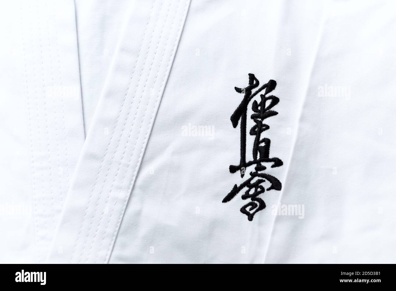 Kyokushinkai karate symbol on cotton background. "Kyokushin" is a style ...