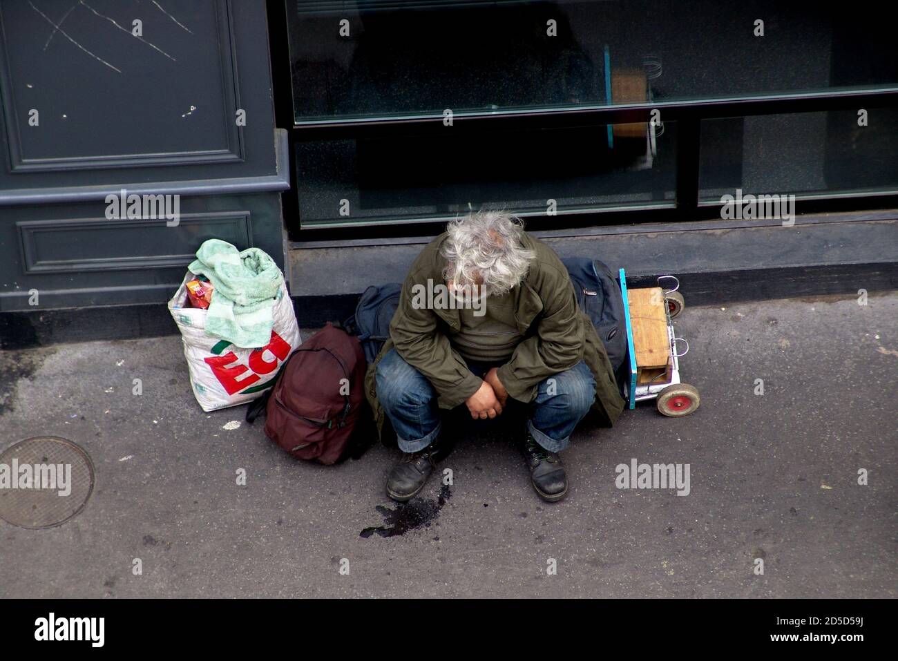 MAN ON THE PAVEMENT HAVING SOME REST - PARIS POVERTY - PARIS STREET ...