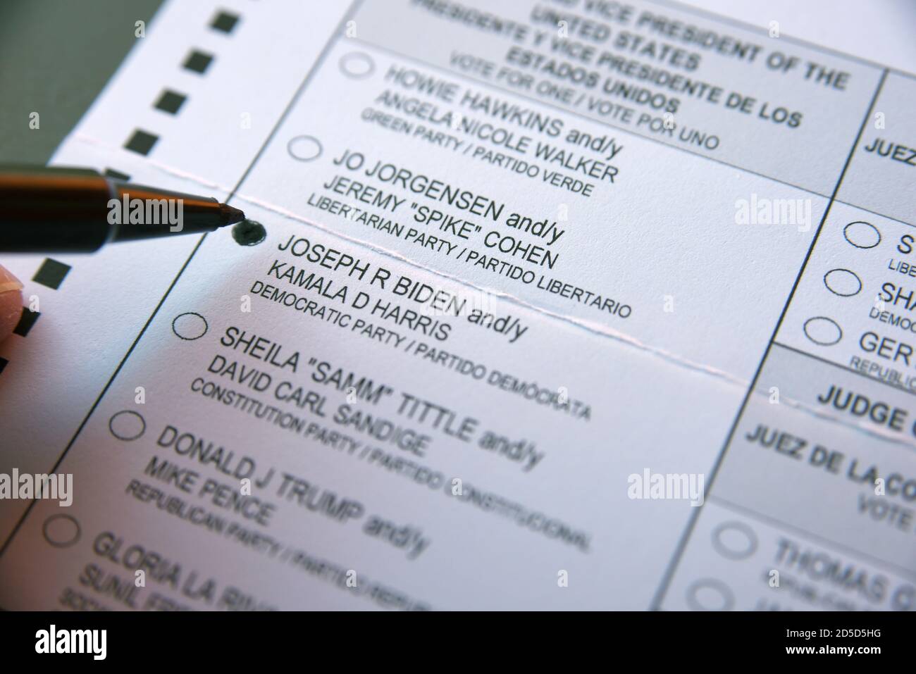 An early voter marks her ballot to vote for former Vice President Joe ...