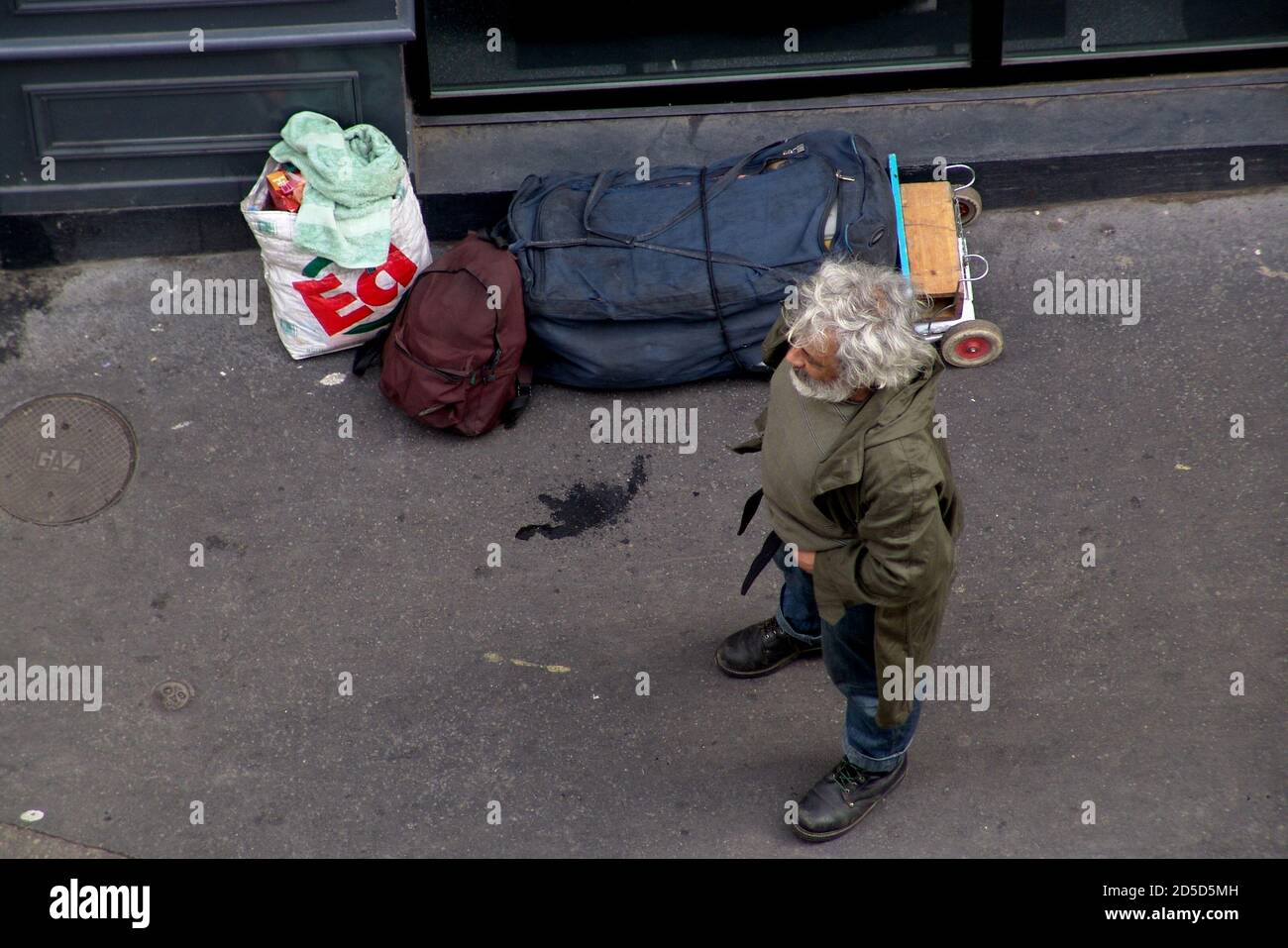 MAN ON THE PAVEMENT HAVING SOME REST - PARIS POVERTY - PARIS STREET ...