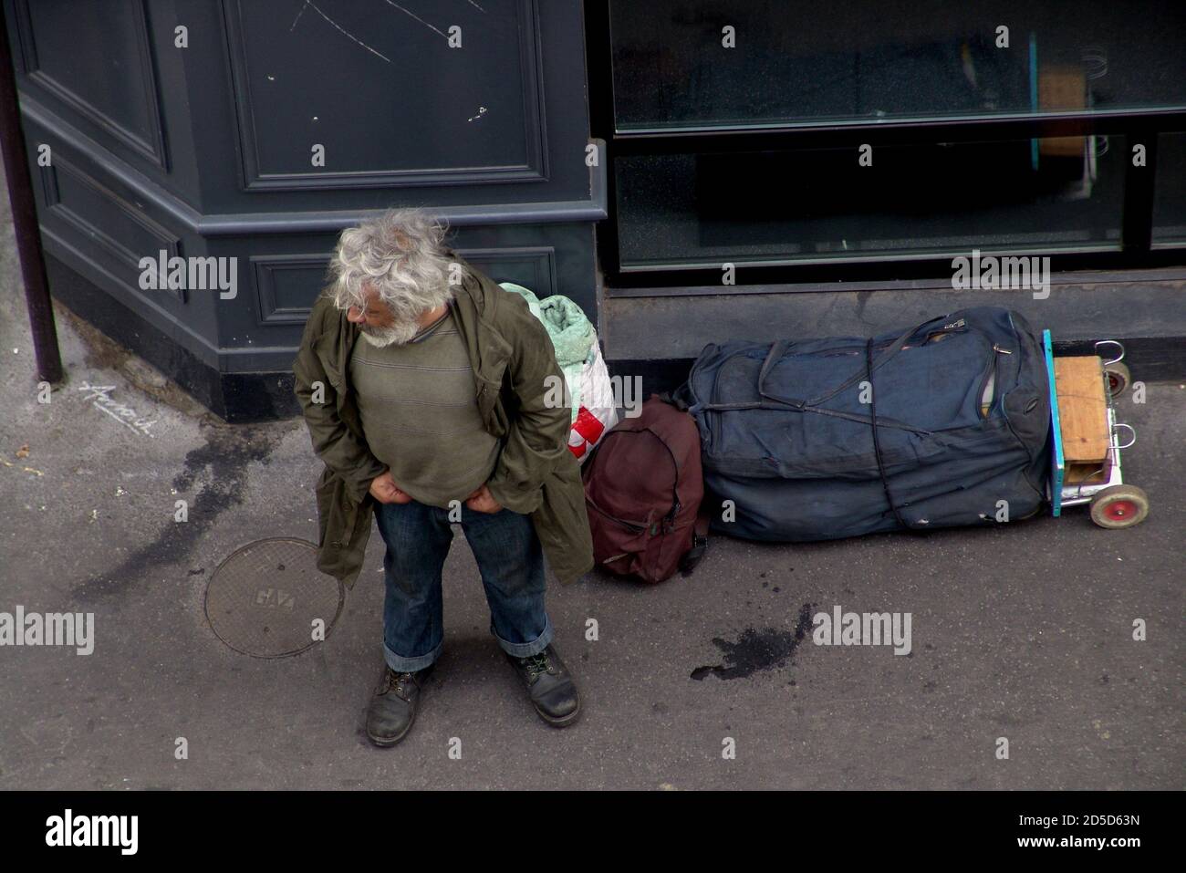MAN ON THE PAVEMENT HAVING SOME REST - PARIS POVERTY - PARIS STREET ...