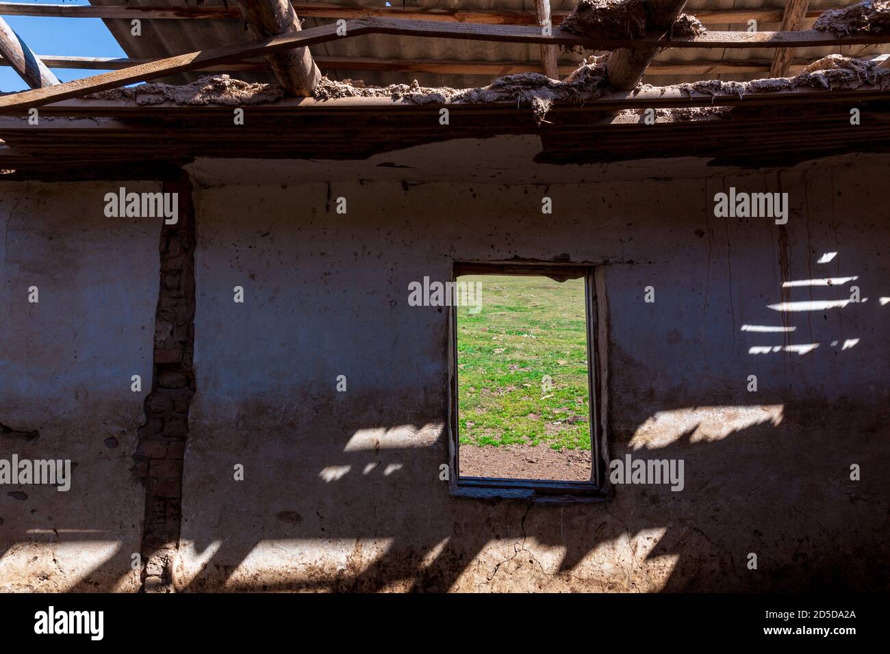 An old abandoned house. No people. The building is made of adobe and ...